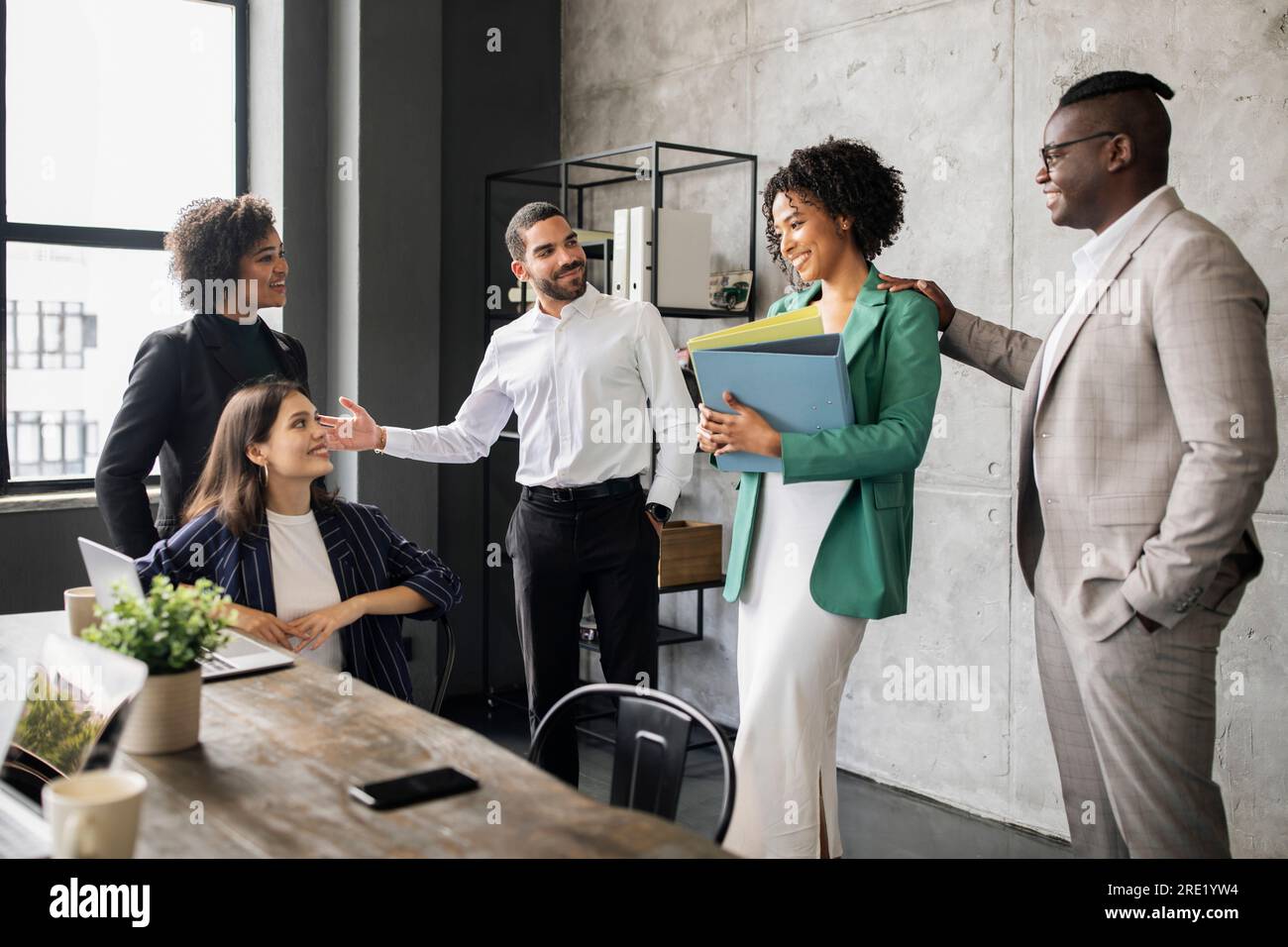Happy Diverse Business Team Welcoming New Coworker Woman At Office ...