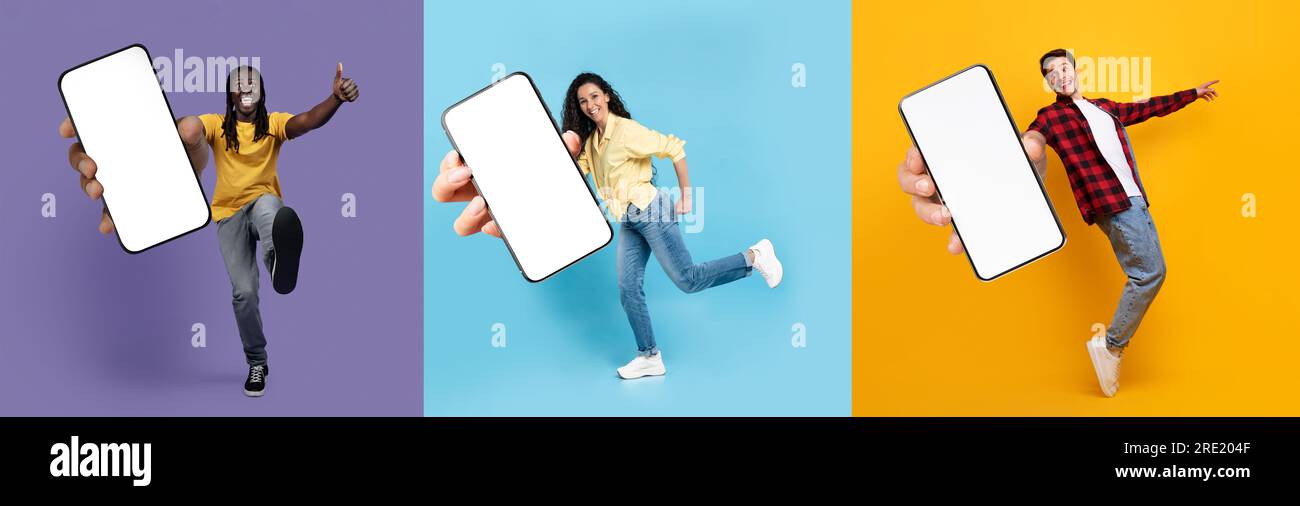 Happy multicultural millennials showing phones while posing on colorful ...