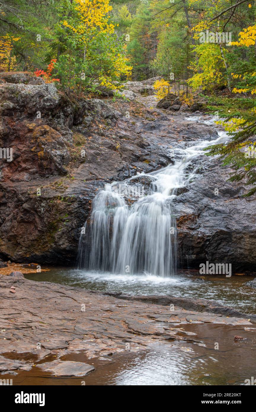 The various river features of the Amnicon River as it flows through Amnicon Falls State Park in ...