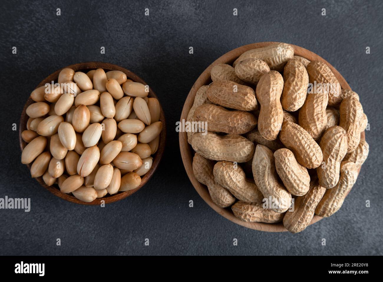 Bowl full of shelled and roasted peeled peanuts on black background,top ...