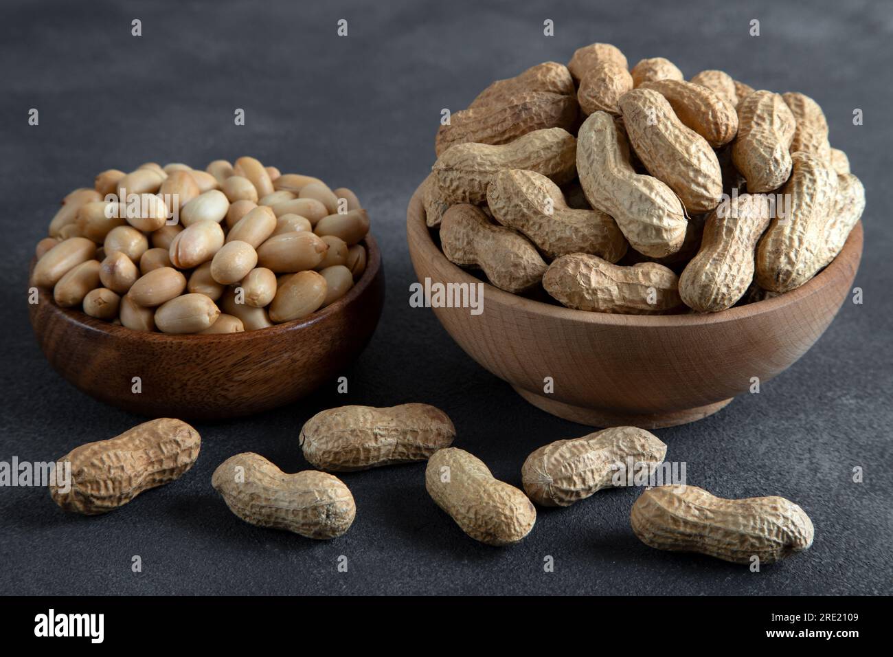 Bowl full of shelled and roasted peeled peanuts on black background,top ...