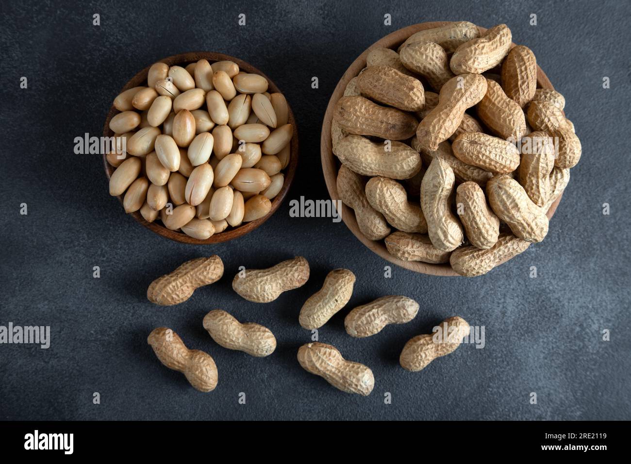 Bowl full of shelled and roasted peeled peanuts on black background,top ...