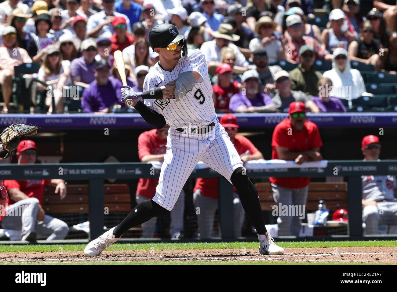 Colorado Rockies center fielder Brenton Doyle (9) swings at the pitch ...