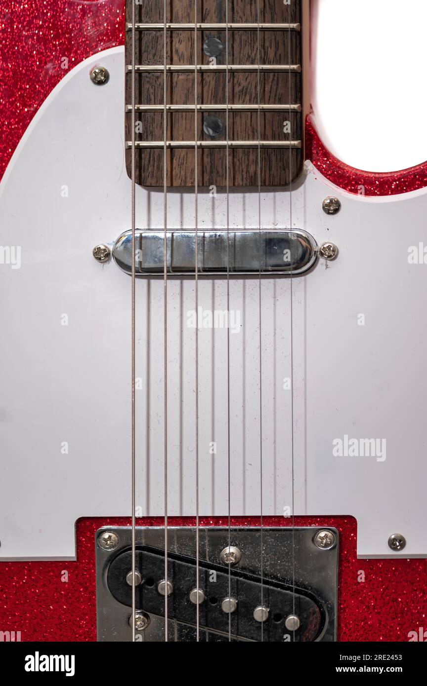 Detail of a telecaster electric guitar where we can see its strings and ...