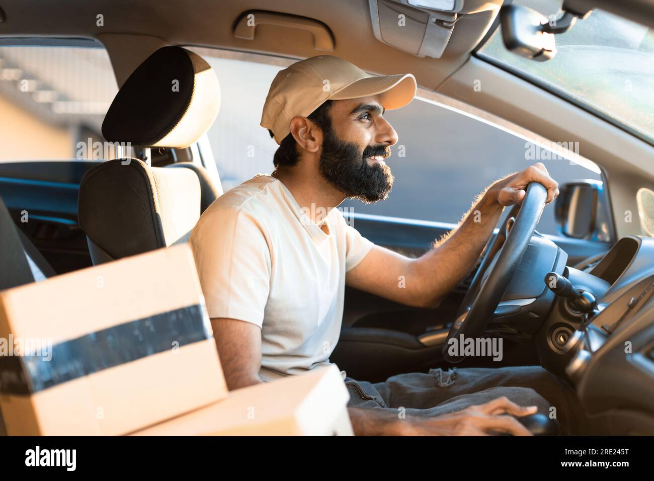 Arabic Courier Man Driving Car Loaded With Parcels And Boxes Stock ...