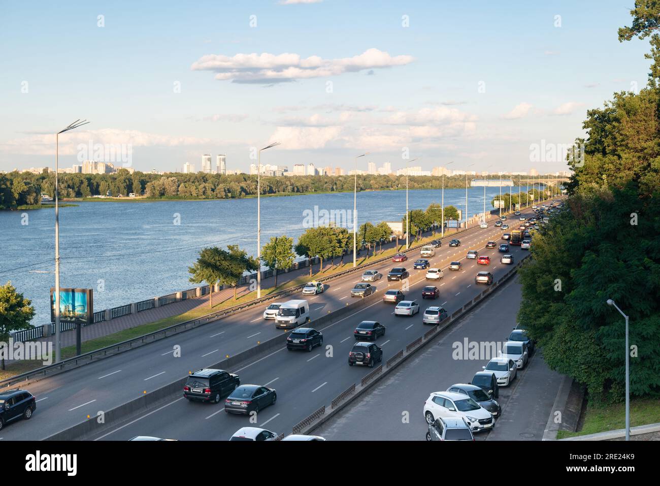 busy traffic of cars along the highway on the embankment. Kiev, Ukraine ...