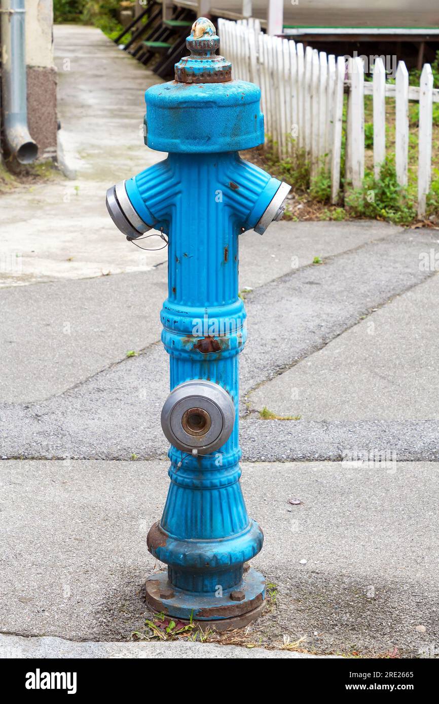 Retro metal hydrant outside on a city street corner Stock Photo - Alamy