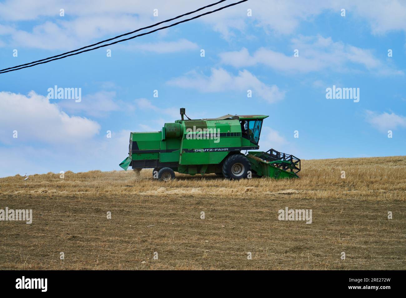Agricultural machine combine working on hi-res stock photography and ...