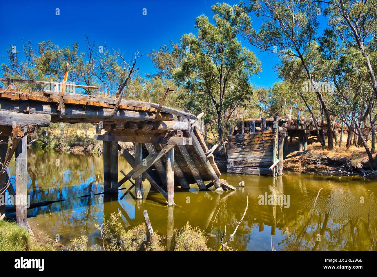 The collapsed old wooden Pumphrey's Bridge over the Hotham River, shire ...