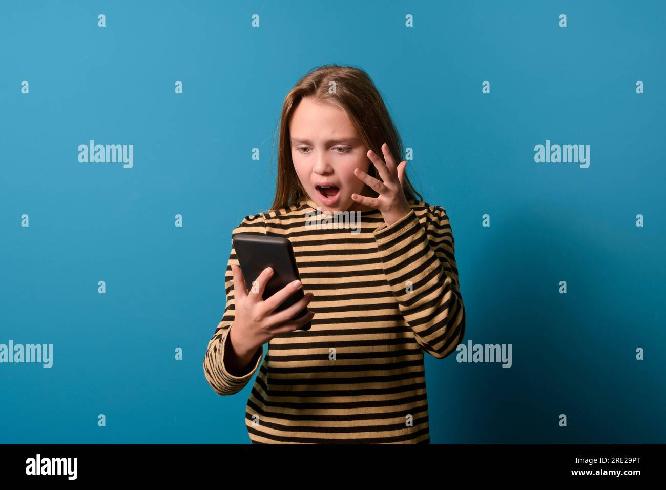 Stress when talking on the phone. Teen girl with mobile phone angry at ...