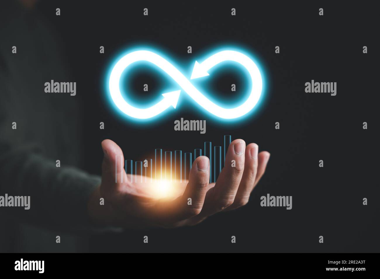 Circular infinity symbol in businessman's hand on dark background Stock ...