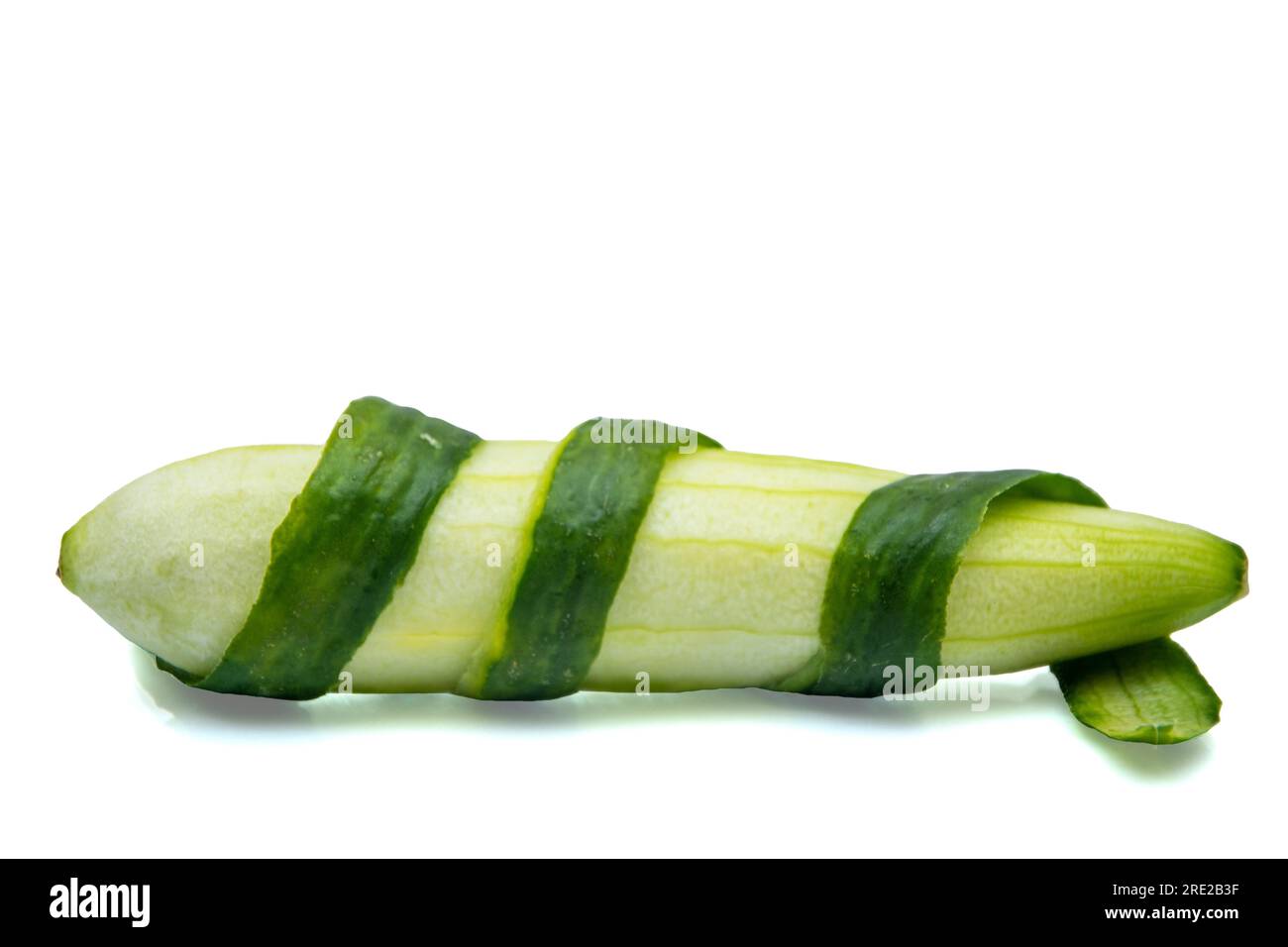 Cucumber wrapped around with cucumber peel on white isolated background ...
