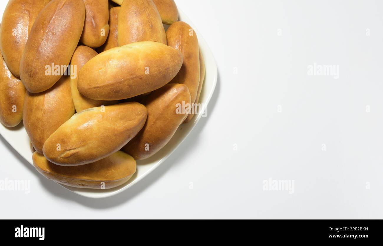 Homemade pies on a white platter.-banner. On a white background Stock ...