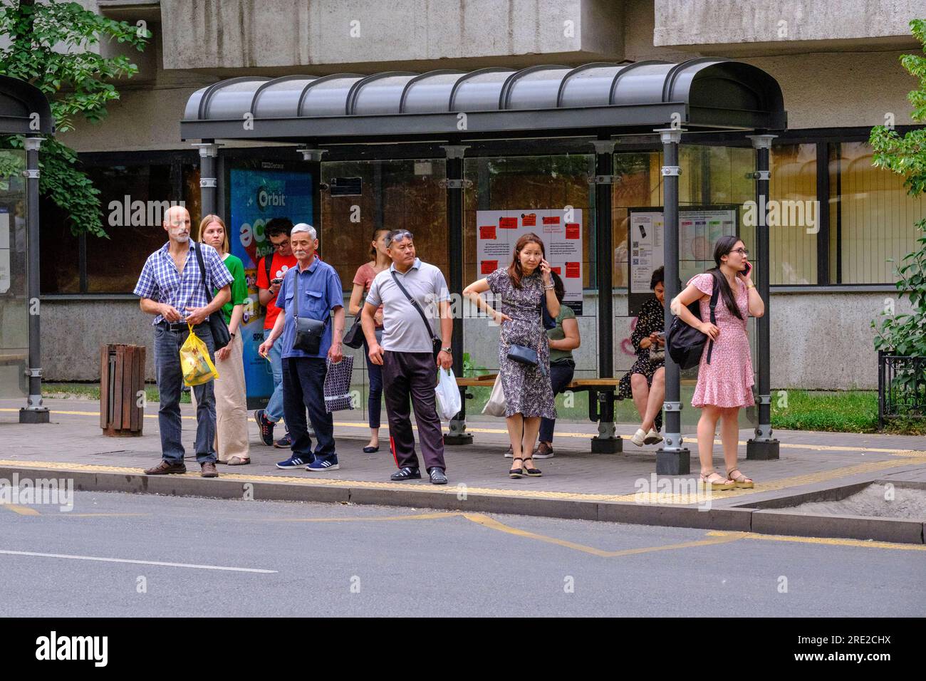 Kazakhstan, Almaty. Street Scene: Passengers Waiting for Bus at Bus ...