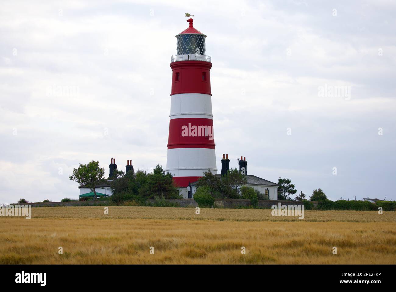 The famous and colourful Happisburgh Lighthouse standing out against ...