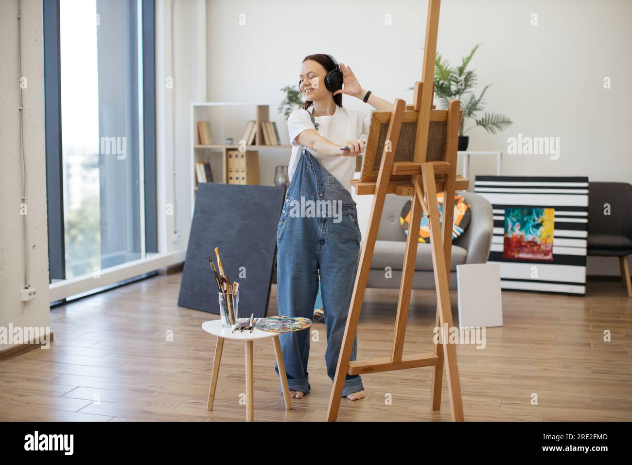 Young woman approaching table in hi-res stock photography and images ...