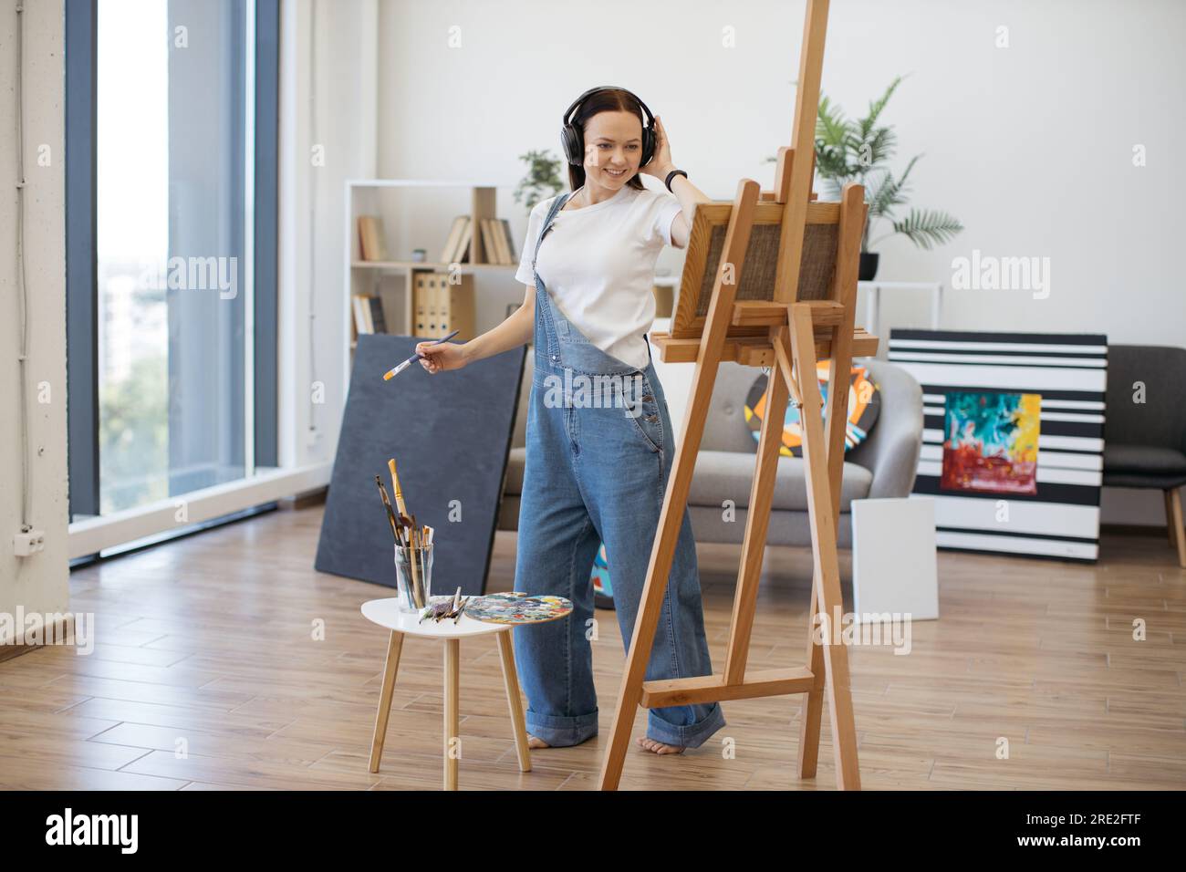 Young woman approaching table in hi-res stock photography and images ...