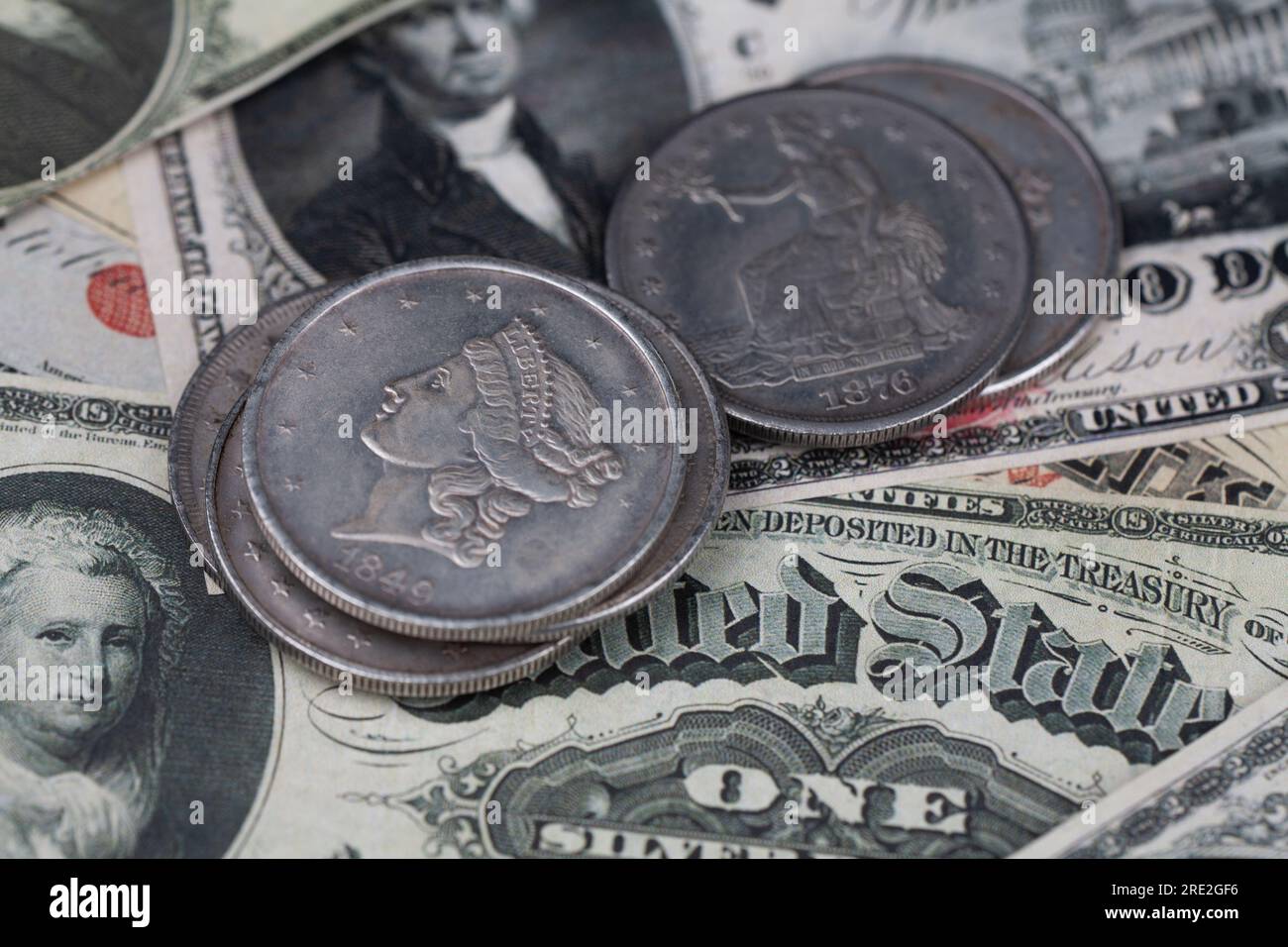 Old west US banknotes and silver certificates with silver dollar coins ...