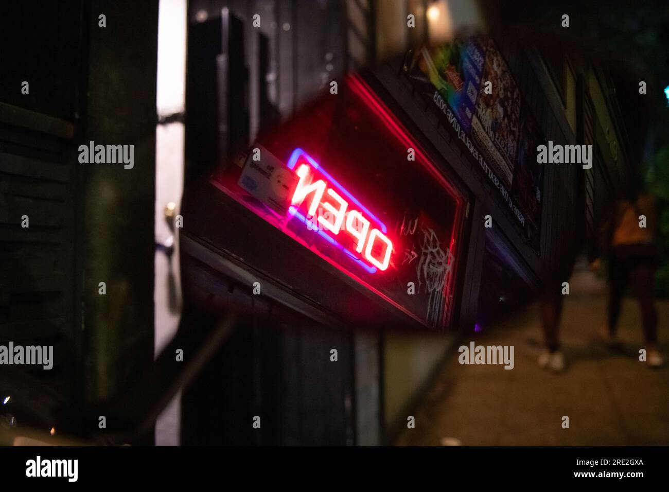Seattle, USA. 9th July, 2023. Open sign reflected in a side mirror on ...