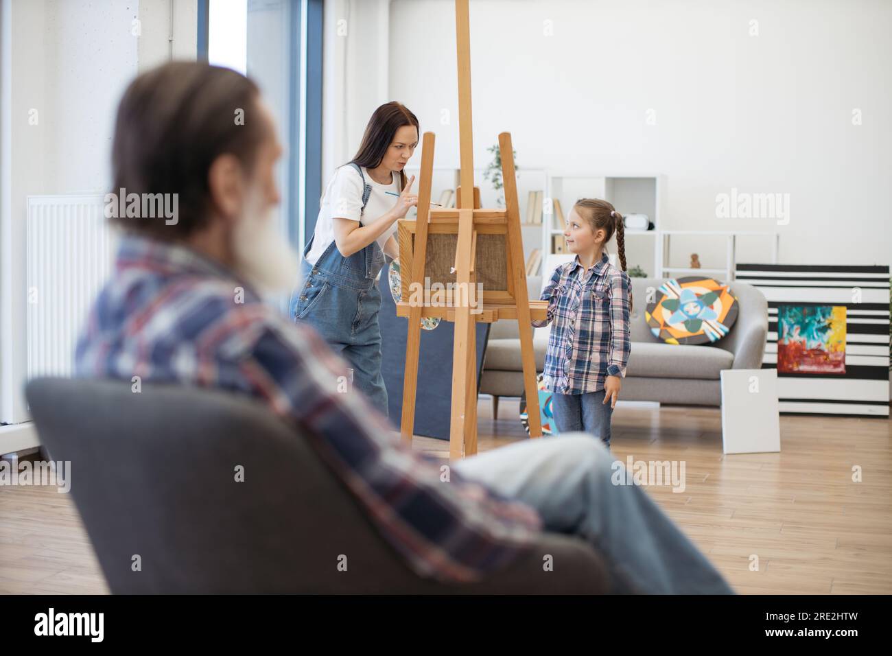 Focus on brunette lady asking cute girl about being cautious while ...