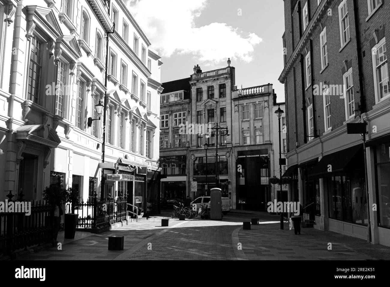a narrow city street with old buildings in the background Stock Photo ...