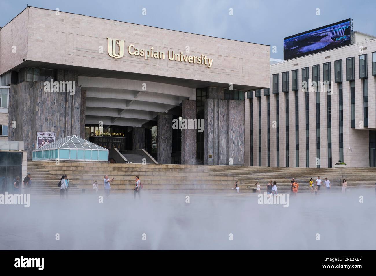 Kazakhstan, Almaty. People Walk through "Fog Fountain" in front of ...