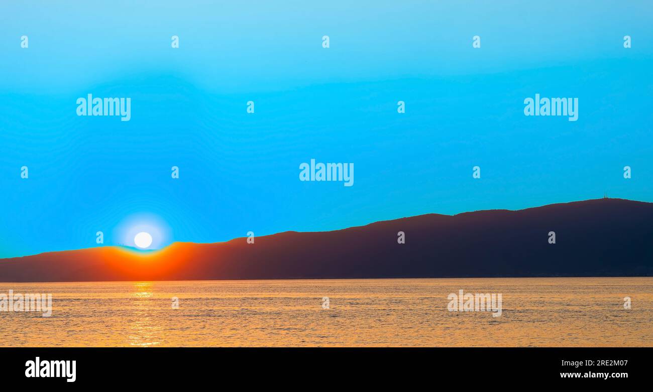 Sunset landscape. Sunset over sea and mountains. Colorful nature banner ...