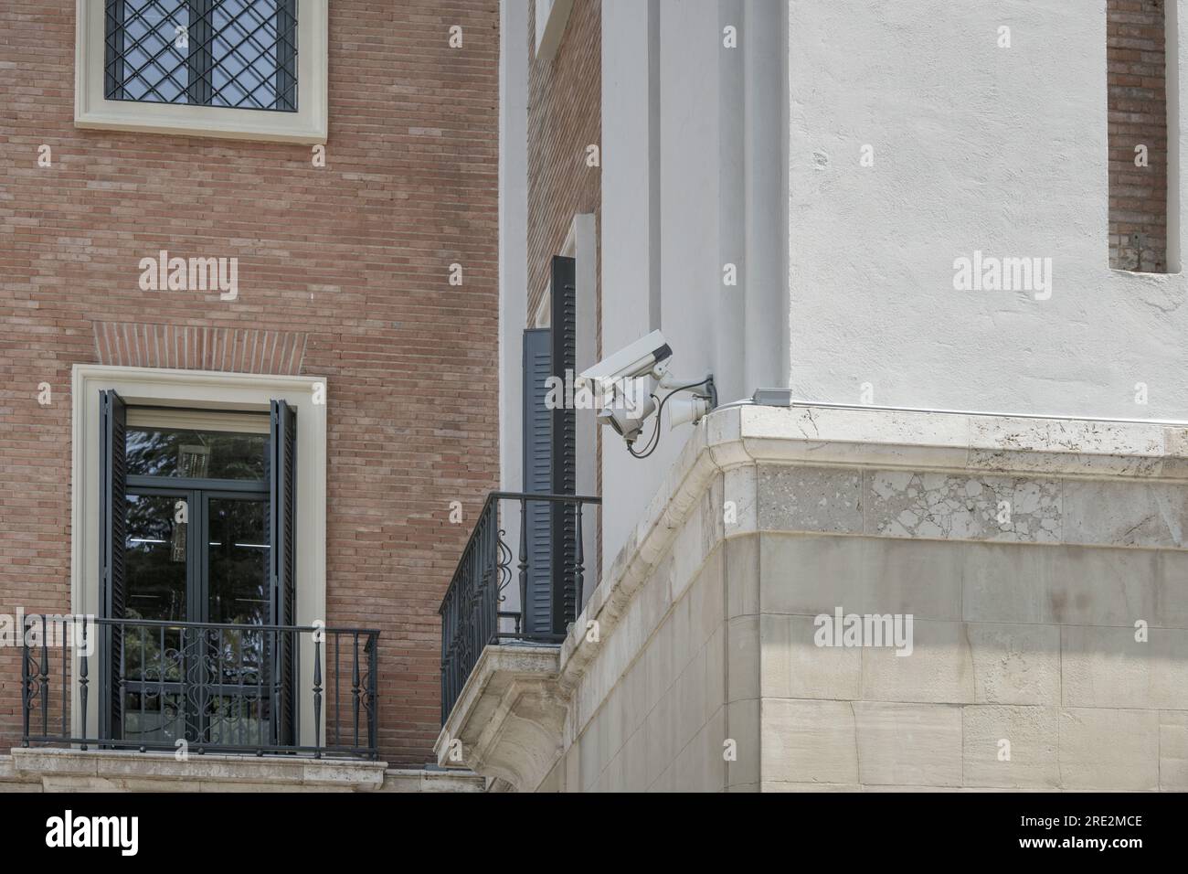 Night light bulb surveillance camera attached to a wall of an old ...