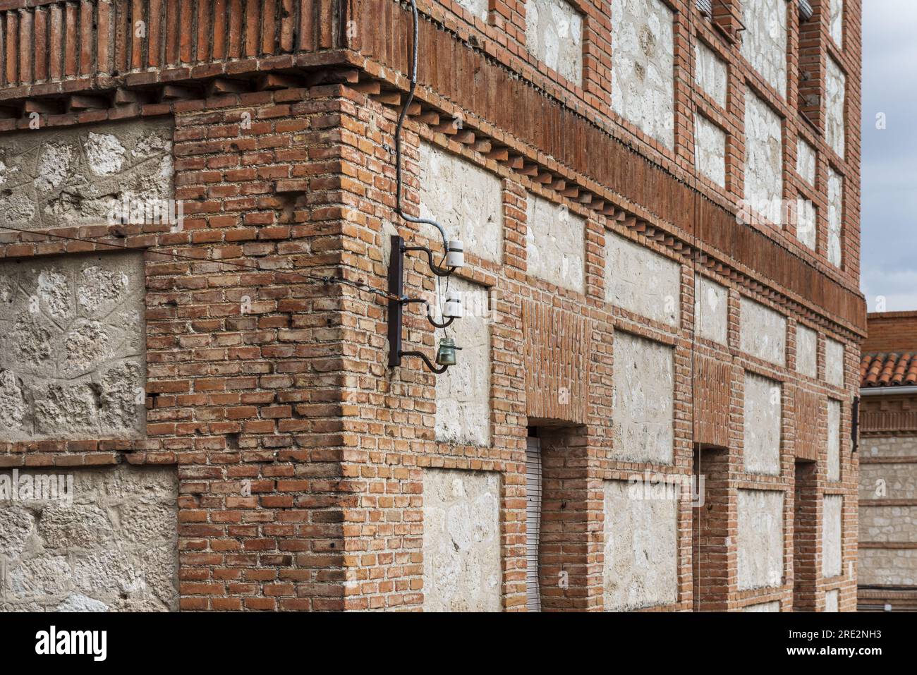 An old building with old-looking clay brick walls and porcelain and ...