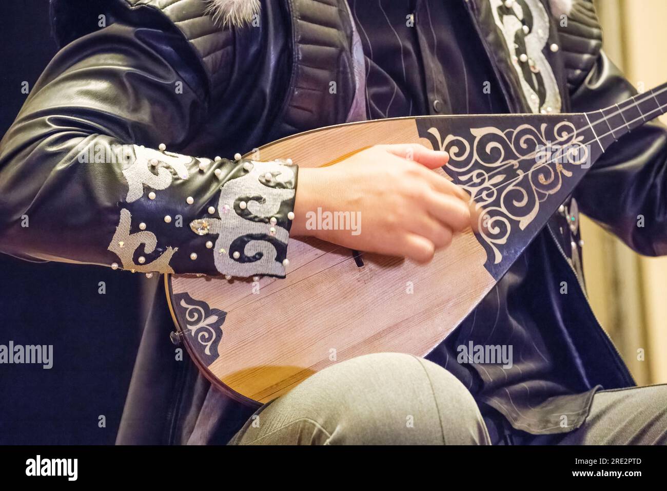 Playing traditional stringed instrument hi-res stock photography and ...