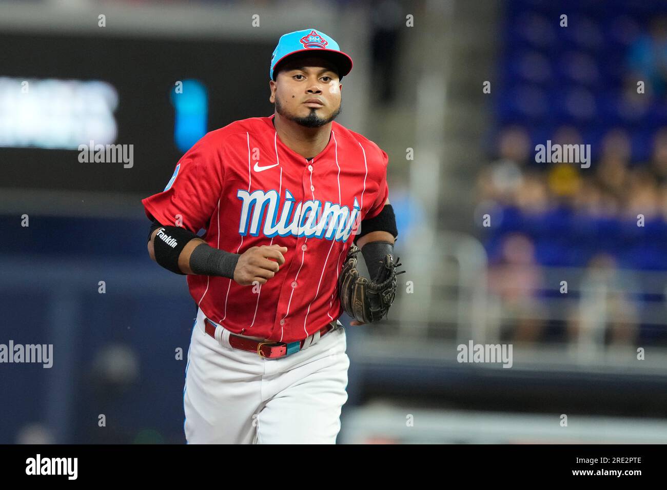 Miami Marlins second baseman Luis Arraez (3) runs back to the dugout ...