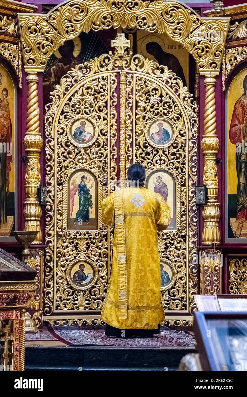 Kazakhstan, Almaty. Priest Reciting Prayers in the Ascension Cathedral ...