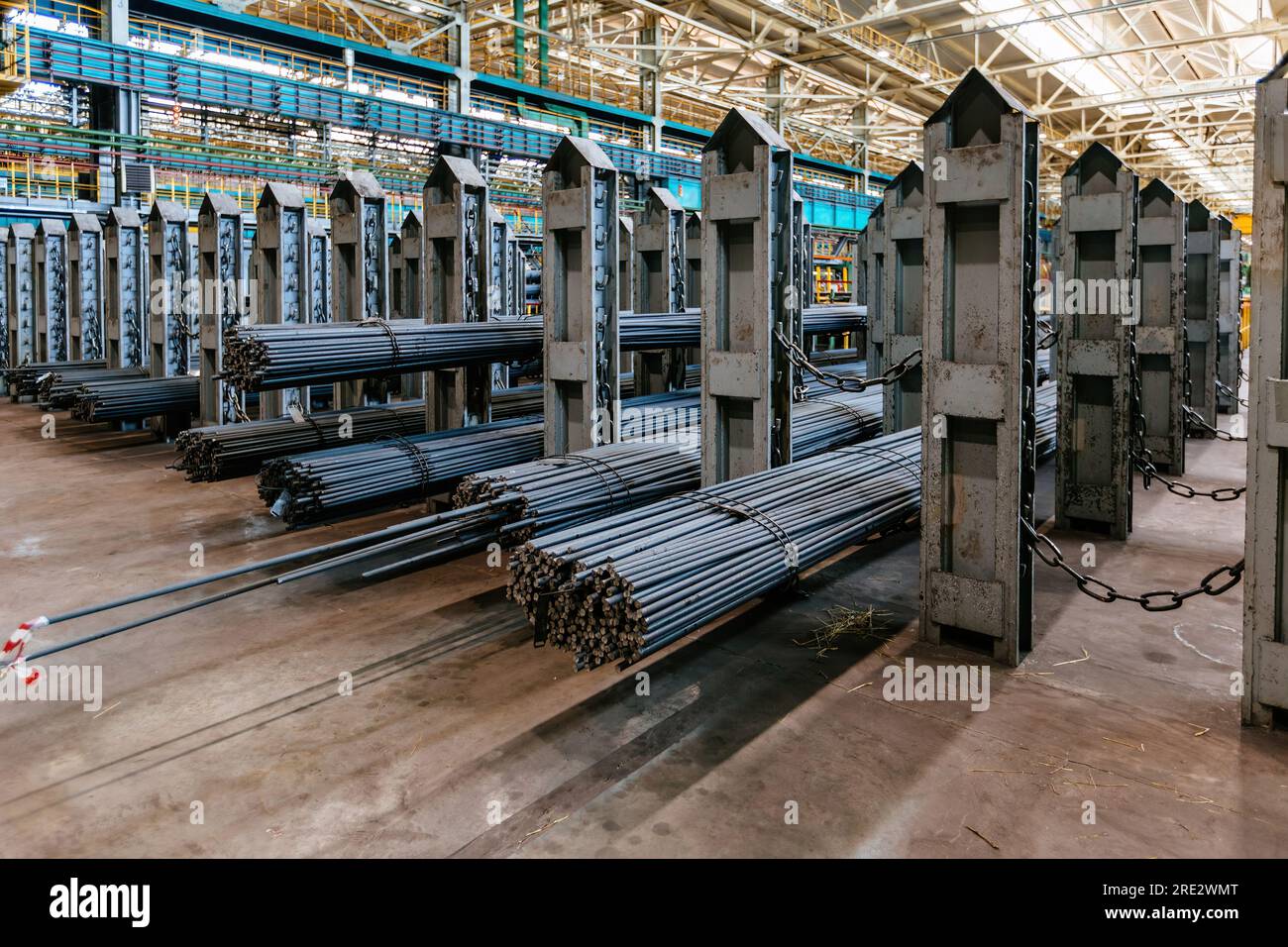 Packs of rolled metal bars on the shelves Stock Photo - Alamy