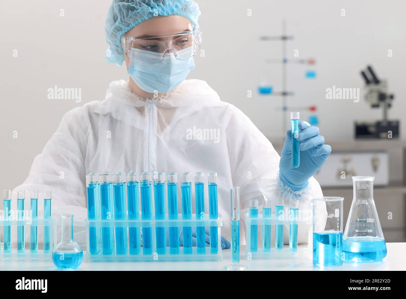 Scientist holding test tube with sample in laboratory Stock Photo - Alamy