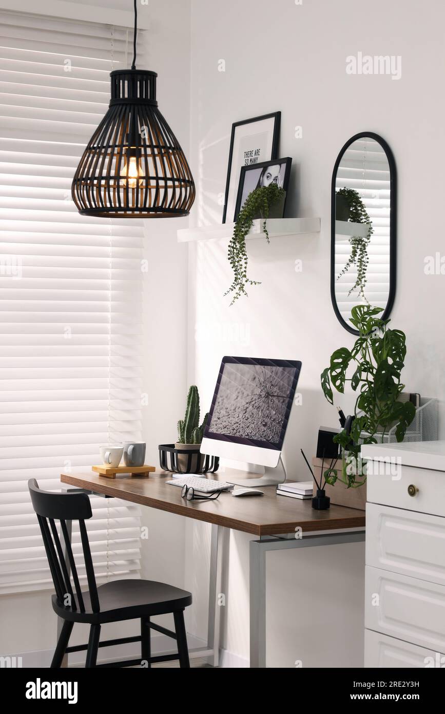 Cozy workspace with computer on wooden desk at home Stock Photo - Alamy