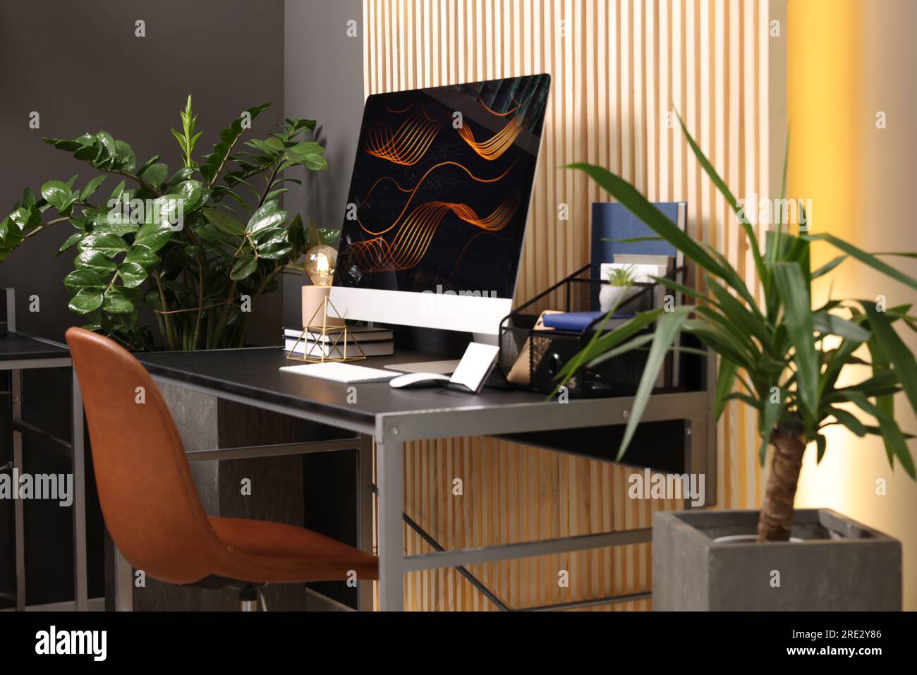 Cozy workspace with computer on metal desk at home Stock Photo - Alamy