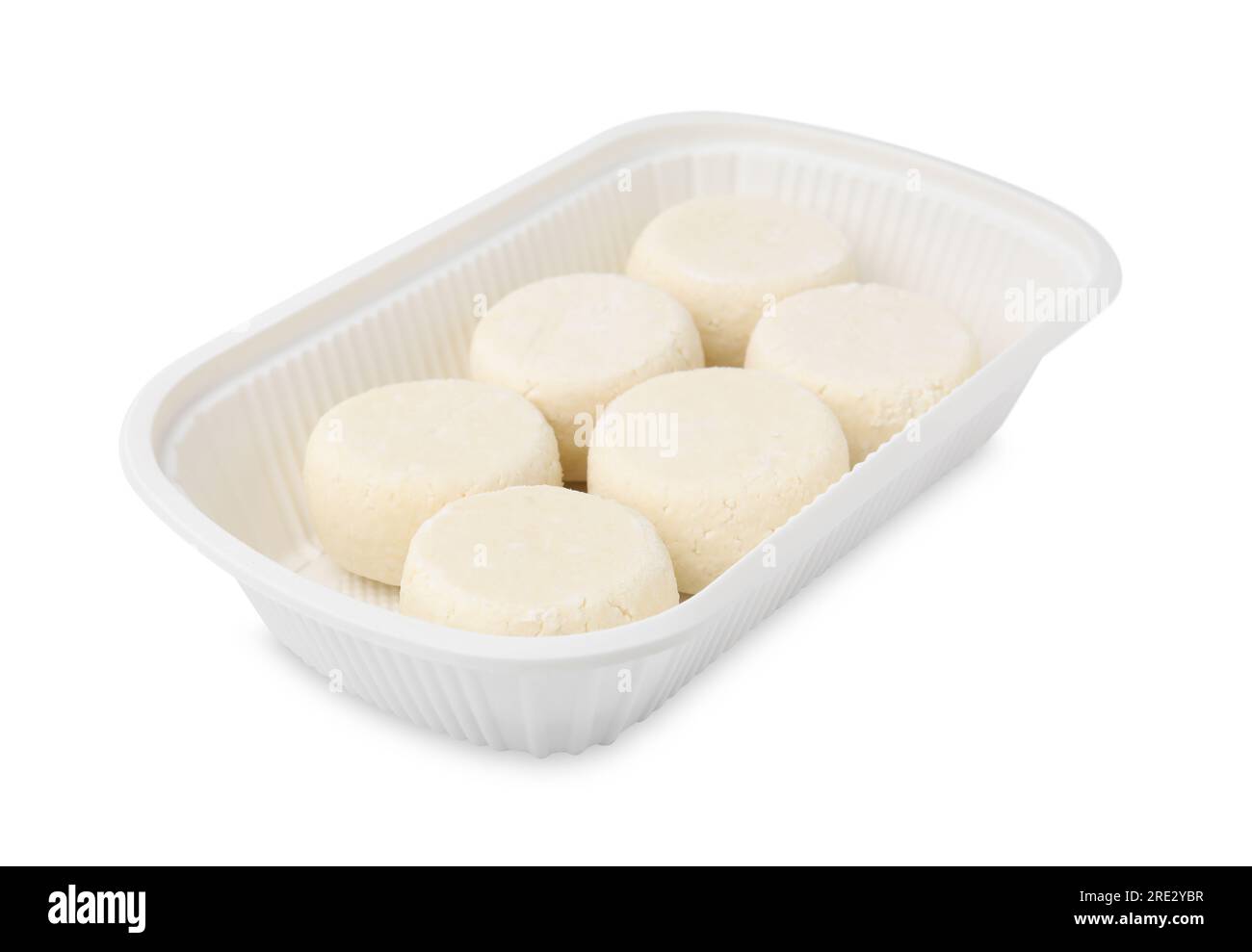 Container with uncooked cottage cheese pancakes isolated on white Stock ...