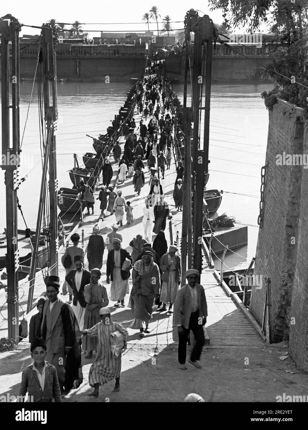 Baghdad, Iraq: 1932 Residents crossing over the Tigris River on the ...