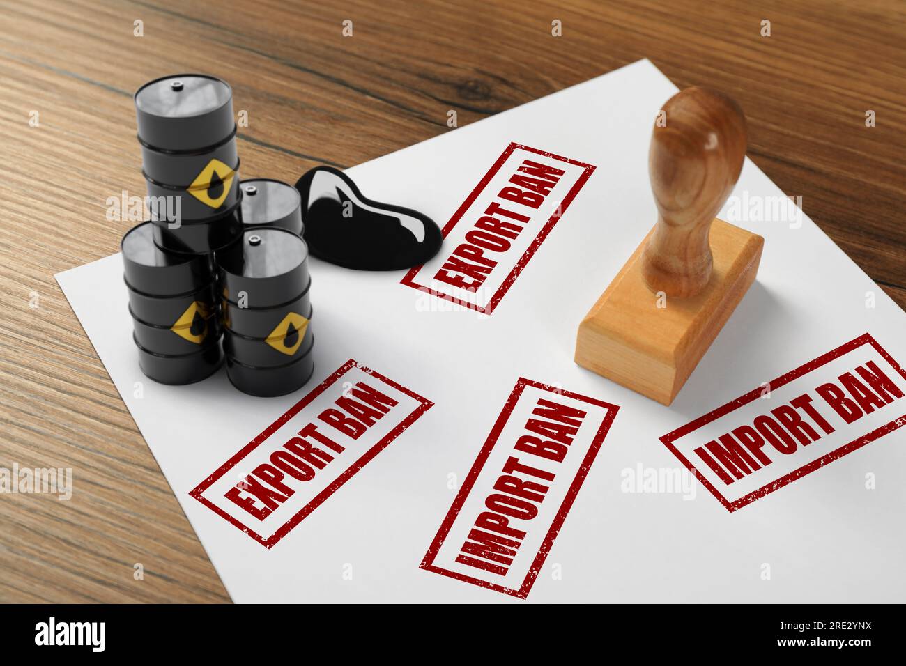 Economic sanctions. Paper with marks, ban stamp and oil barrels on ...