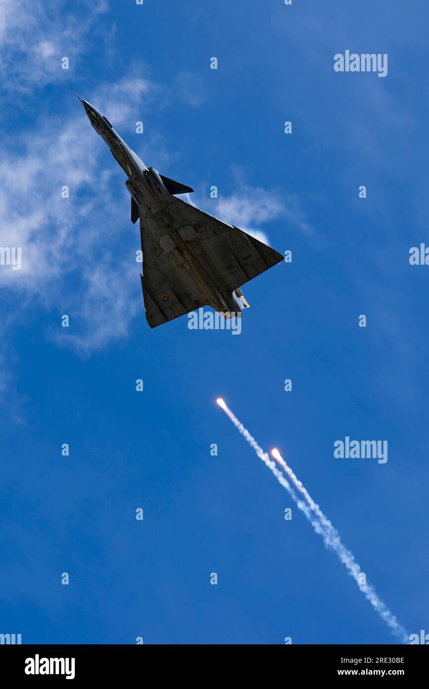 A Colombian Air Force Kfir fighter jet releases flares during F-AIR ...