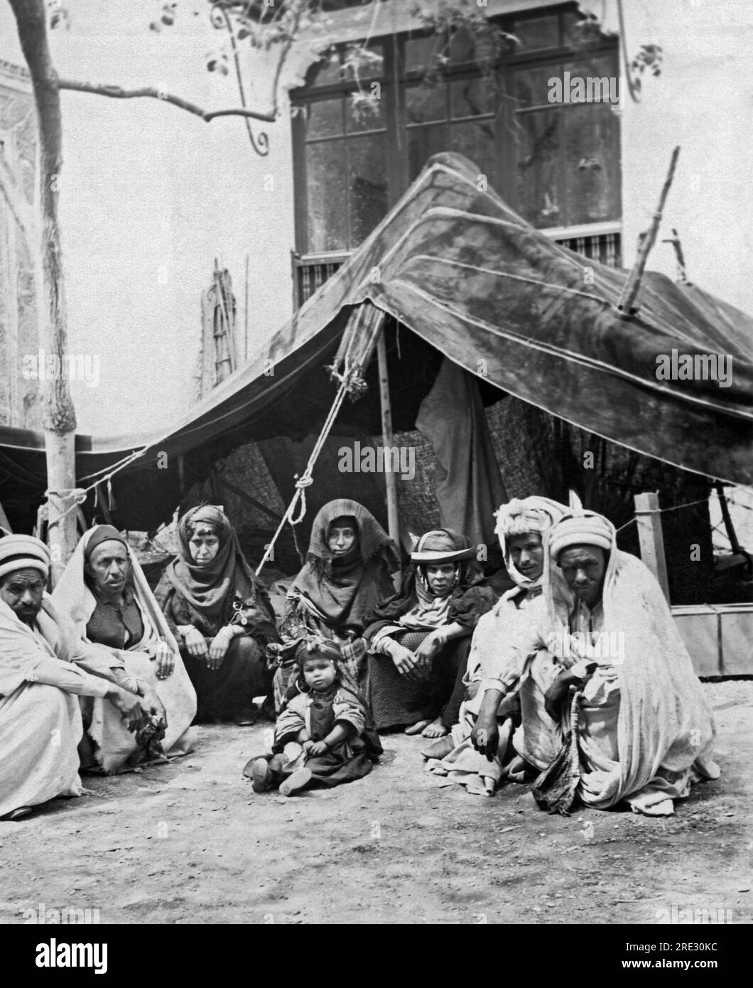Iraq c 1926 An Iraqi family sitting in an urban setting Stock Photo - Alamy