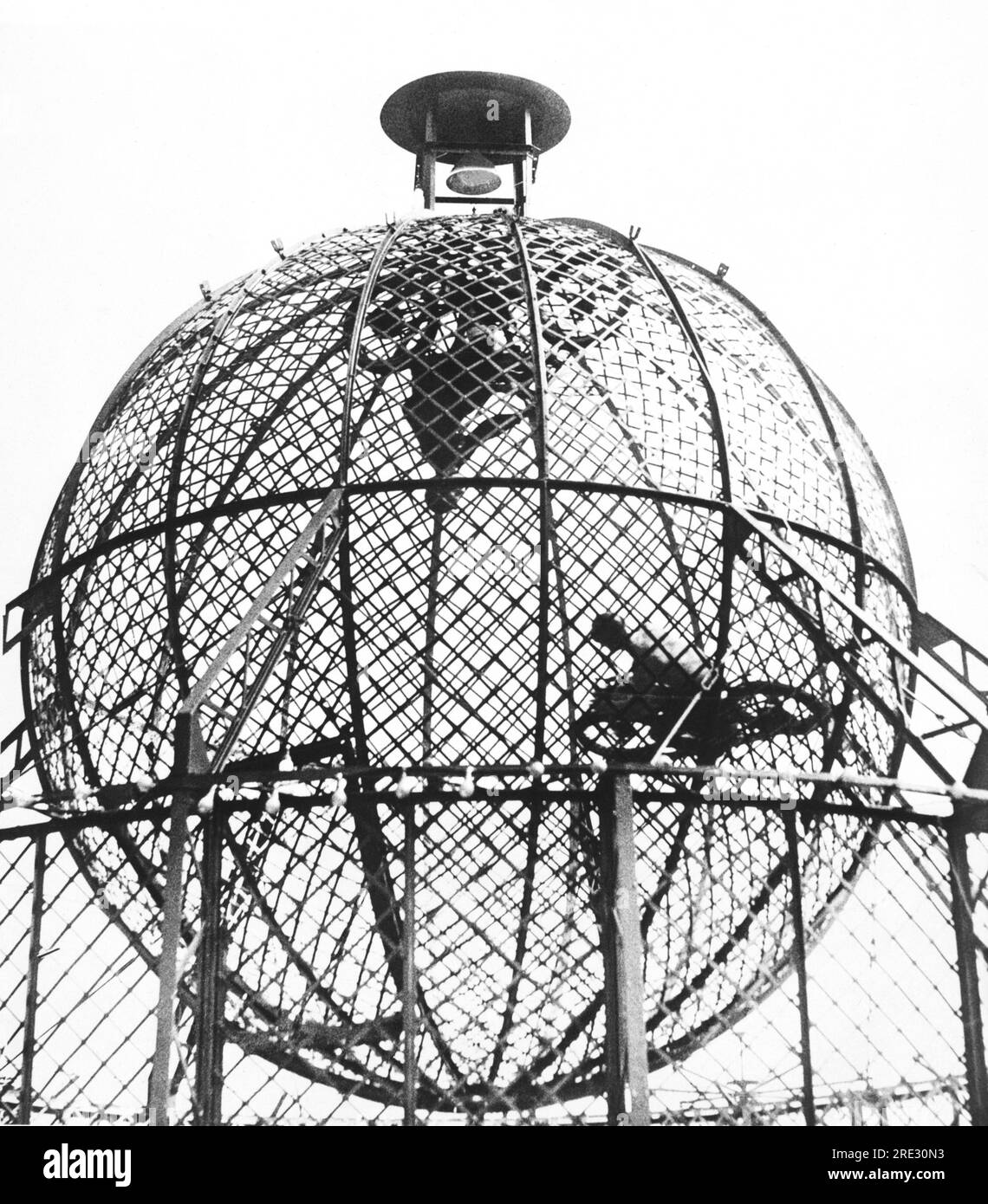 Paris, France: June 6, 1933 Stunt motorcycle riders are giving ...