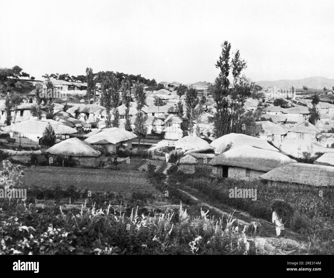 Korea: January 7, 1944 A Korean village with thatched roof huts Stock ...