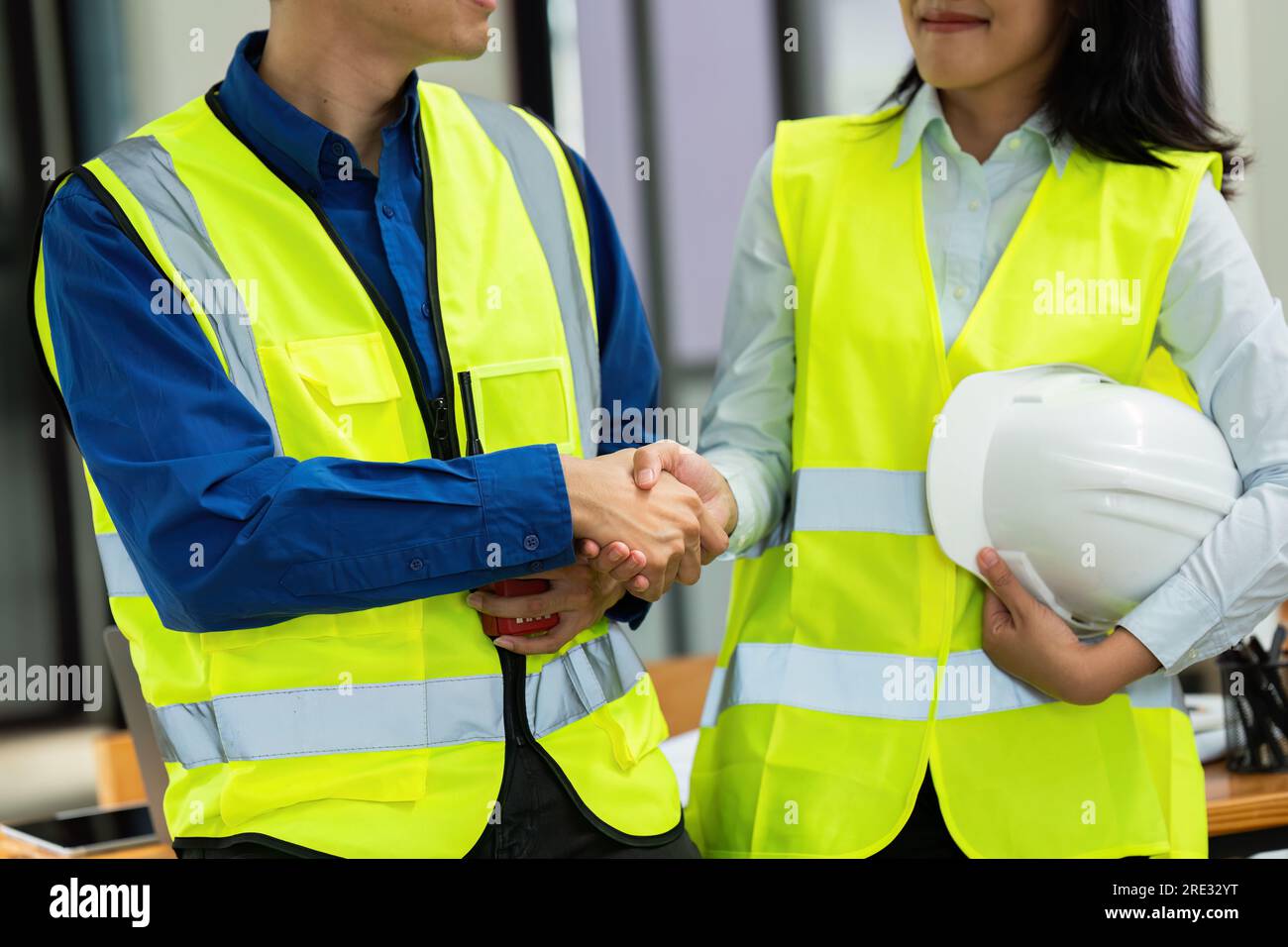 Civil engineers and architects handshake after work done at the office ...