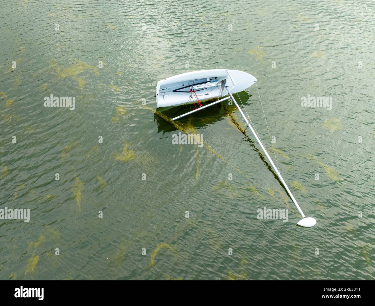 Small capsized sail boat on lake after an afternoon summer storm Stock ...