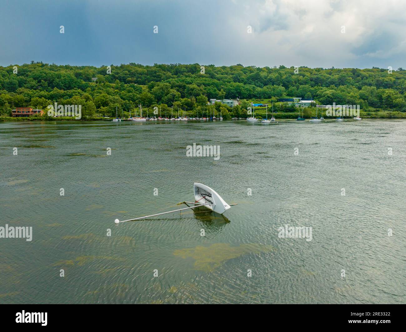 Small capsized sail boat on lake after an afternoon summer storm Stock ...
