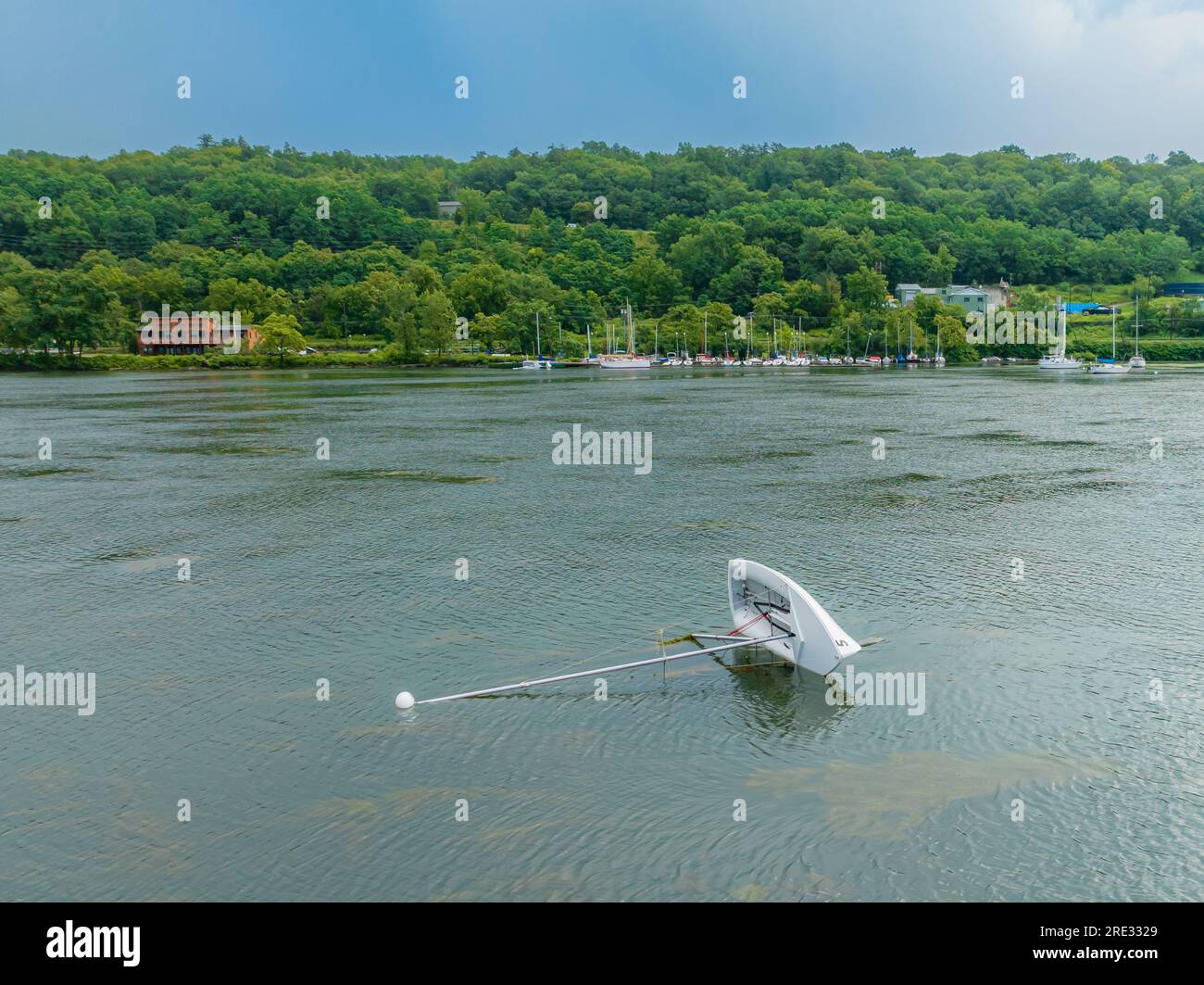 Small capsized sail boat on lake after an afternoon summer storm Stock ...