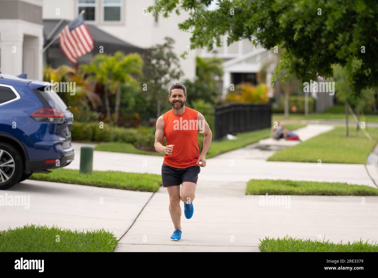 sport fit man jogging outdoor. running happy man races down the ...