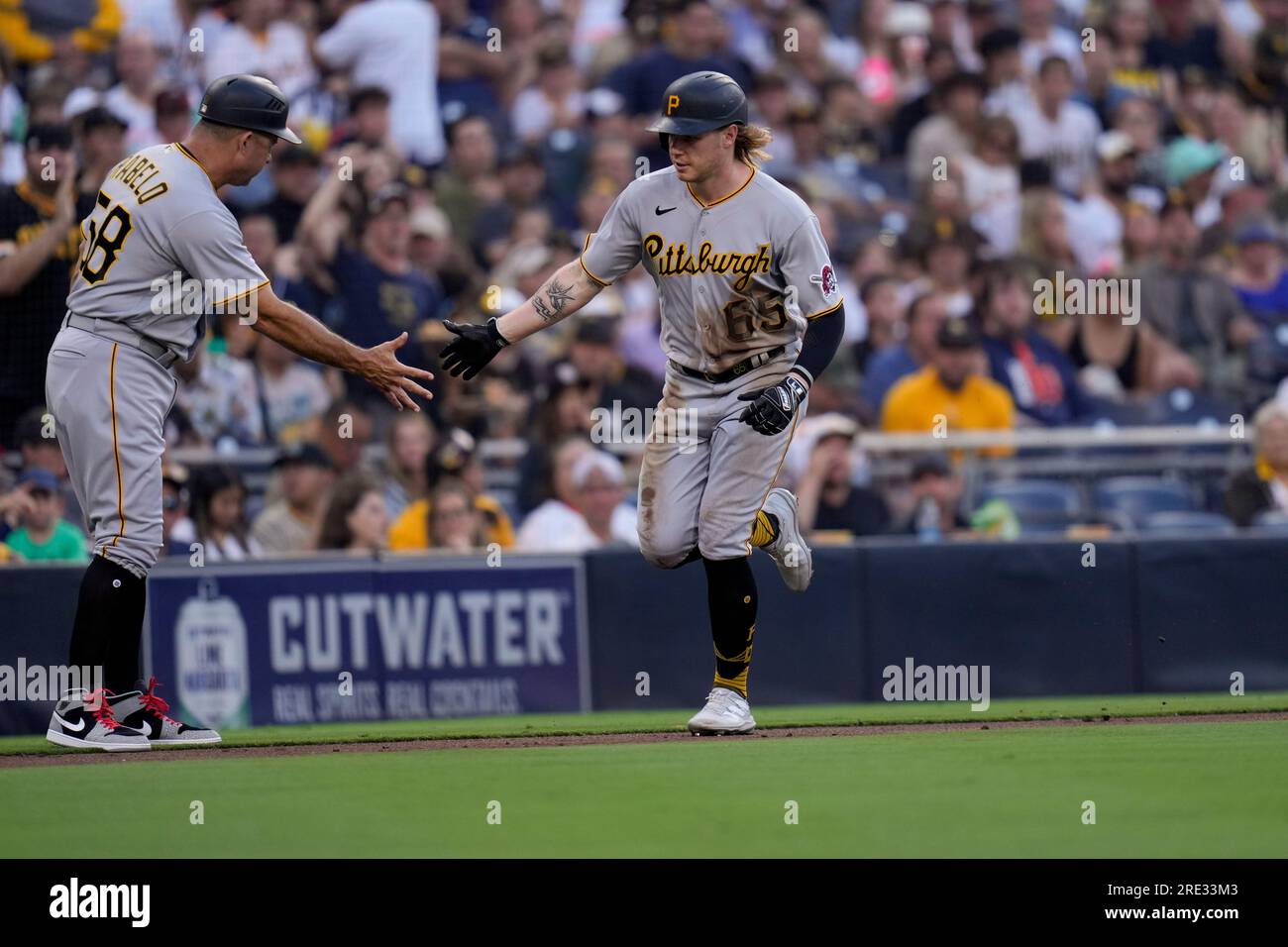 Pittsburgh Pirates' Jack Suwinski, right, celebrates with third base ...