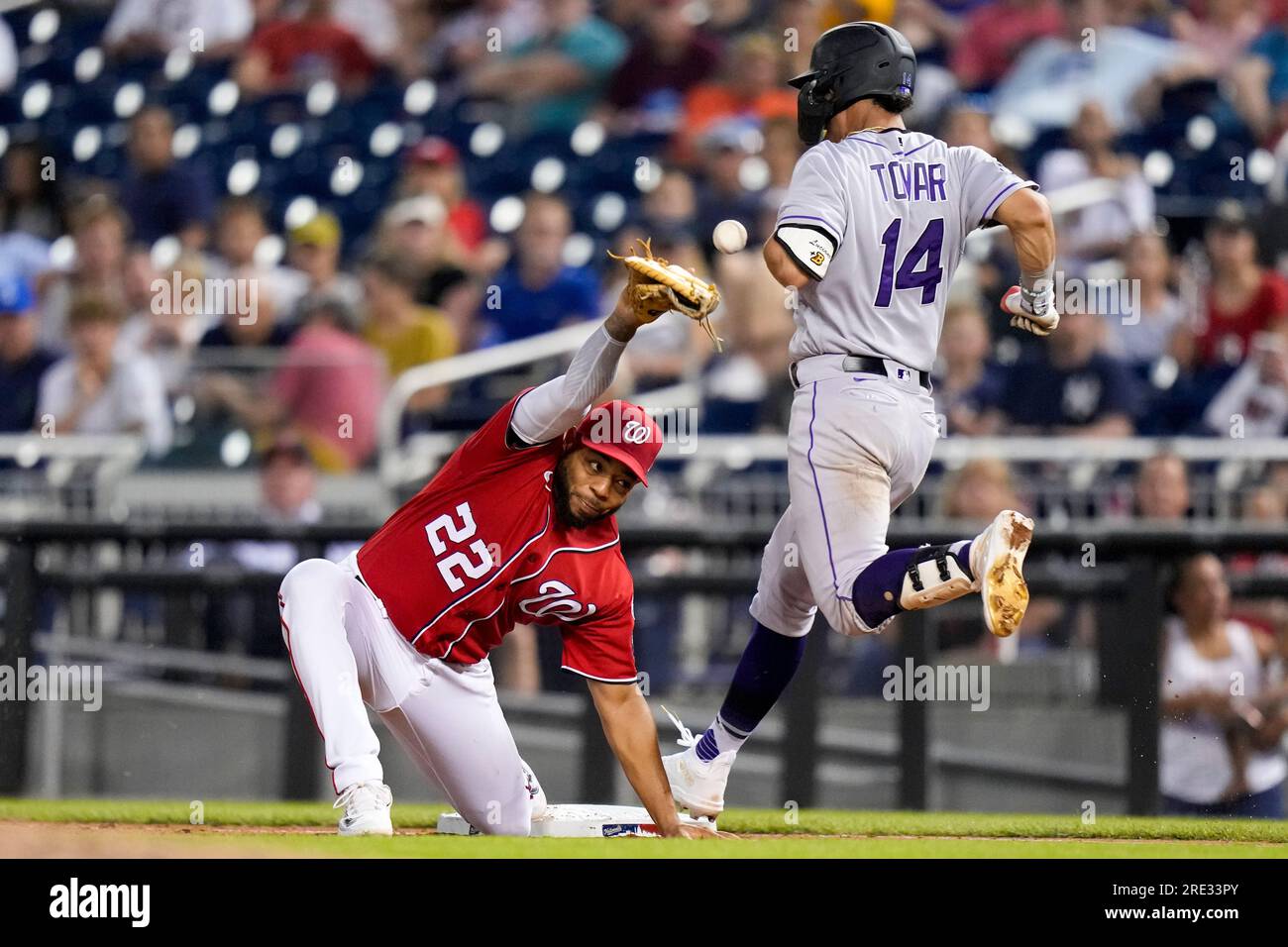 Washington Nationals first baseman Dominic Smith (22) cannot handle a ...